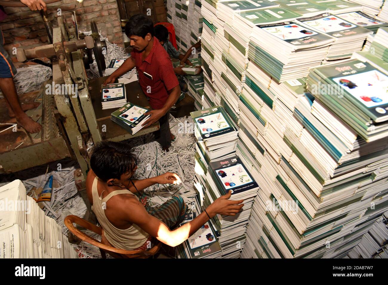 Bangladeshi worker works in a book binding factory in Dhaka City in ...