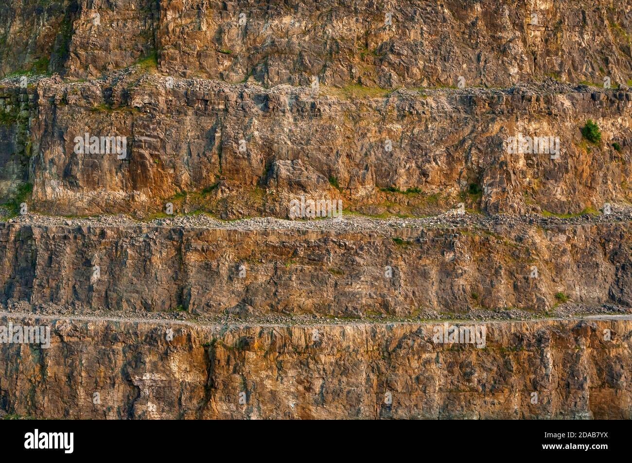 Steep benches of excavated limestone in the abandoned Eldon HIll Quarry ...