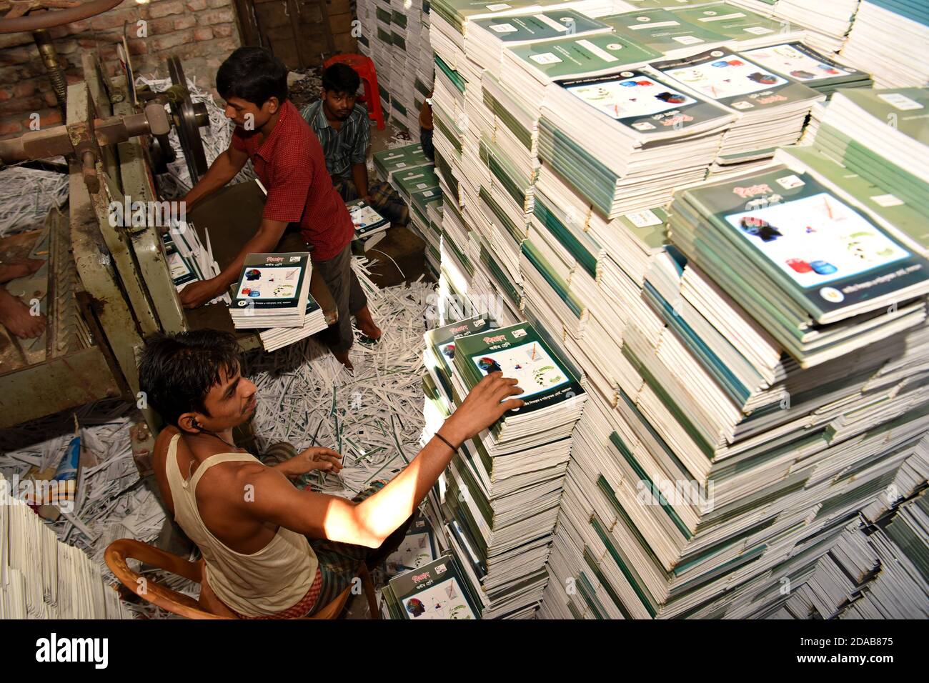 Bangladeshi worker works in a book binding factory in Dhaka City in ...