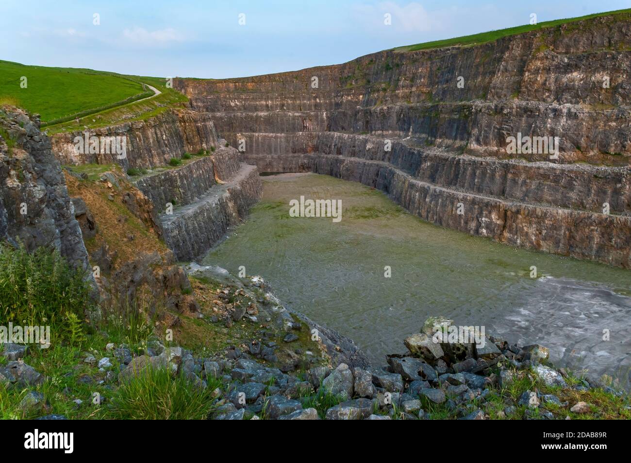 Steep benches of excavated limestone in the abandoned Eldon HIll Quarry ...