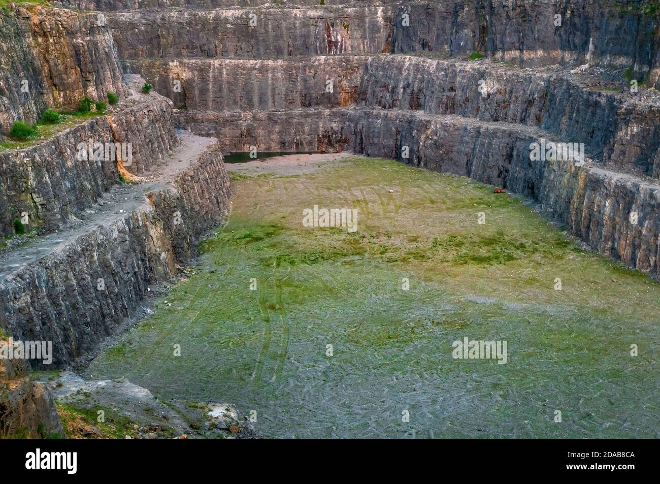 Steep benches of excavated limestone in the abandoned Eldon HIll Quarry ...