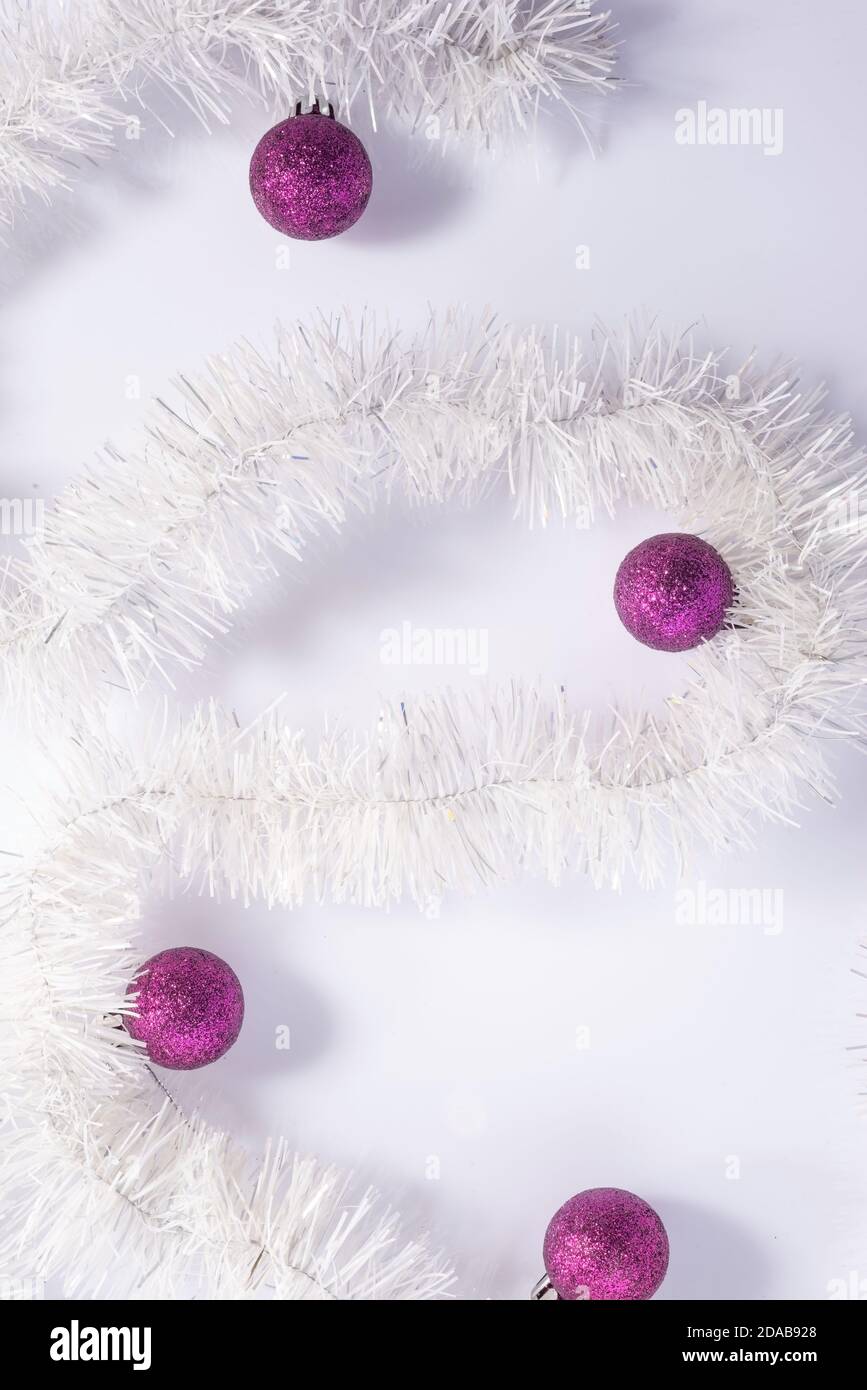 christmas flatlay with purple decorations on white background Winter ...