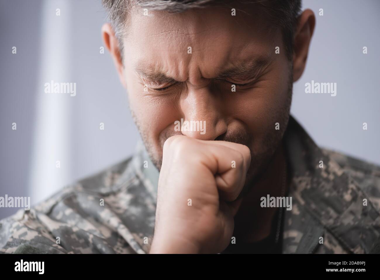 soldier in military uniform crying with closed eyes Stock Photo - Alamy