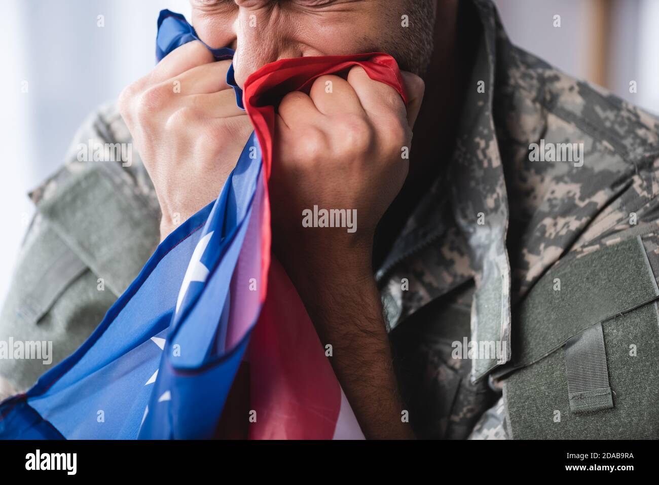 Army man holding usa flag hi-res stock photography and images - Alamy