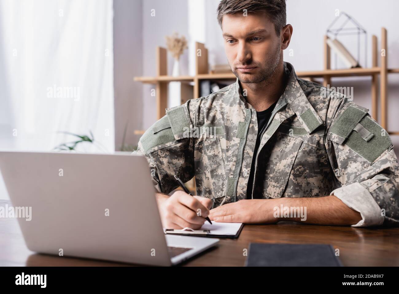 Military man writing hi-res stock photography and images - Alamy