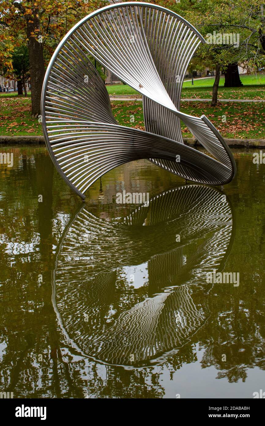 Stainless steel sculpture reflects in Bushnell Park's pond in Hartford ...