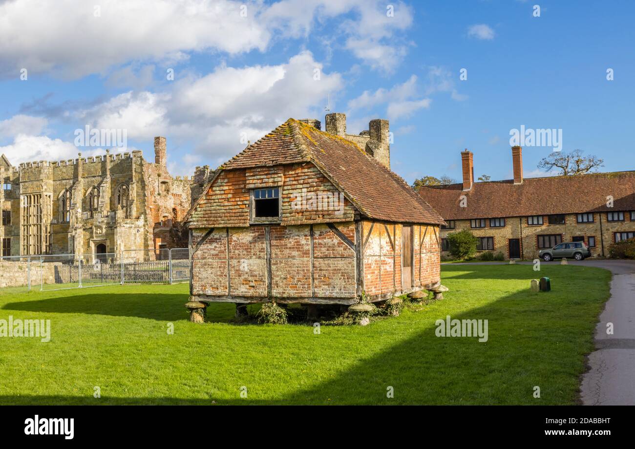 Traditional granary barn standing on staddle stones in the ruins of ...