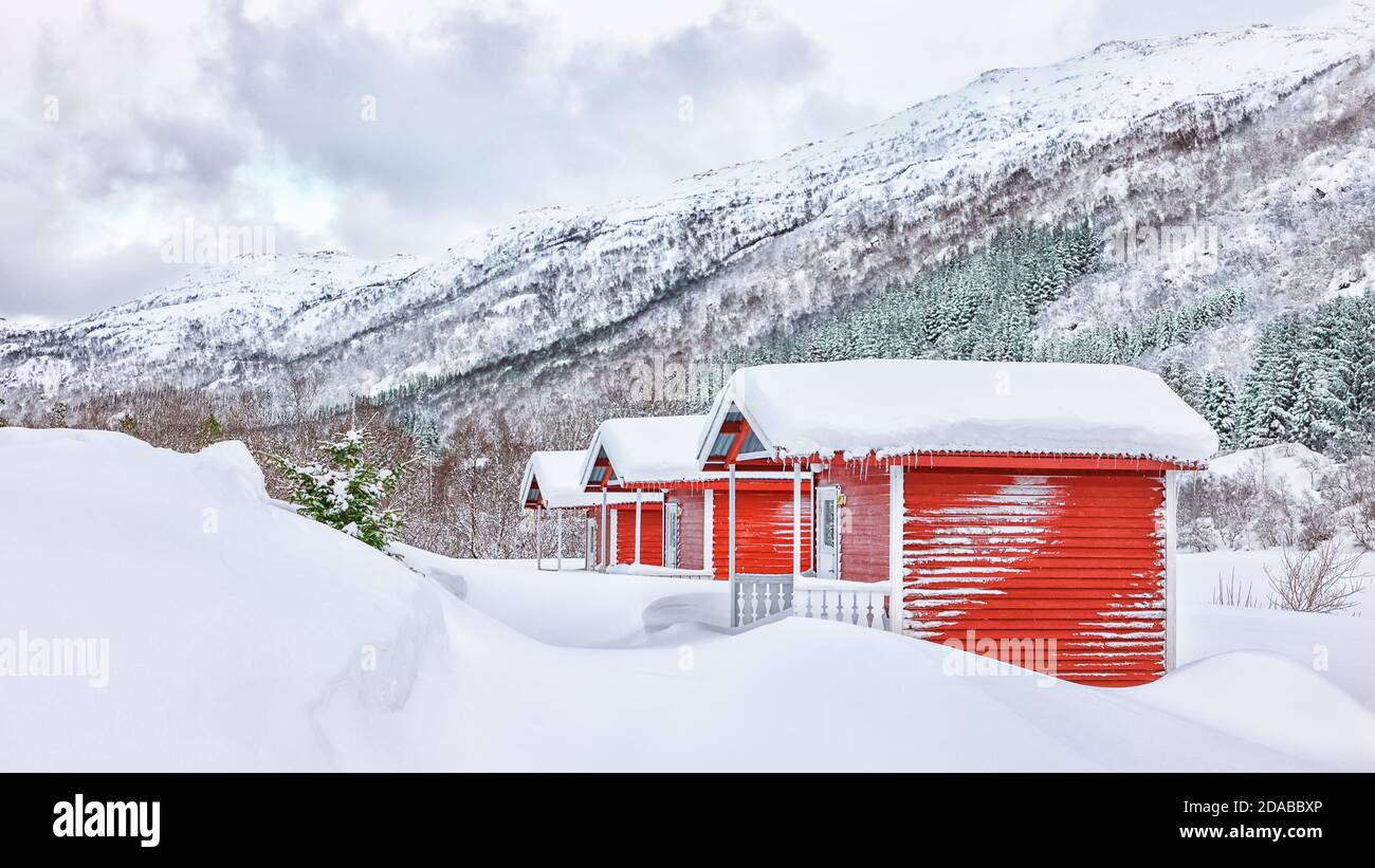 Traditional Norwegian architecture and winter scenery with red wooden ...