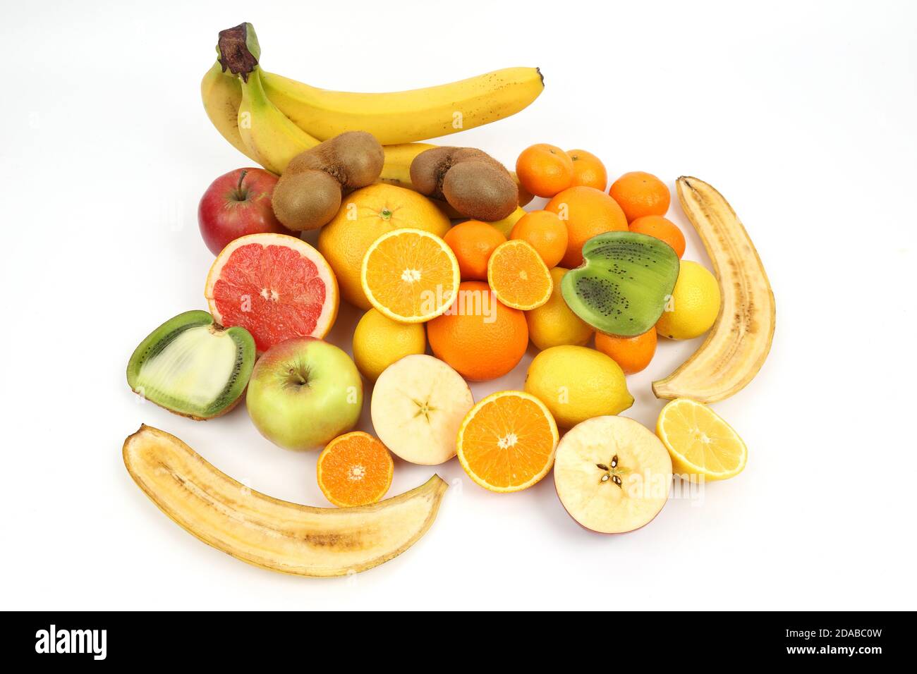 different fruit whole and sliced on white background Stock Photo - Alamy