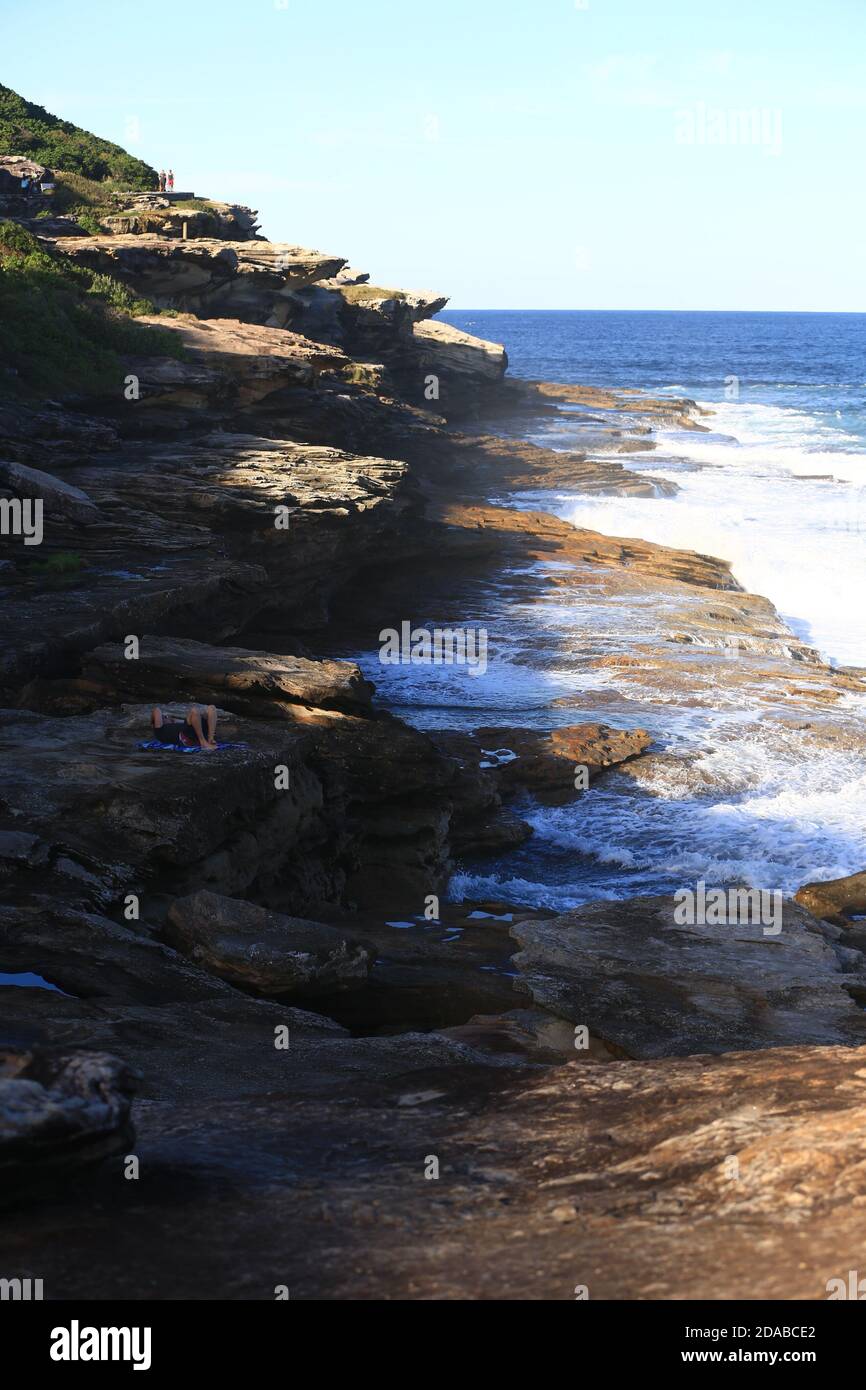 Bondi beach with wave and rocks Stock Photo - Alamy