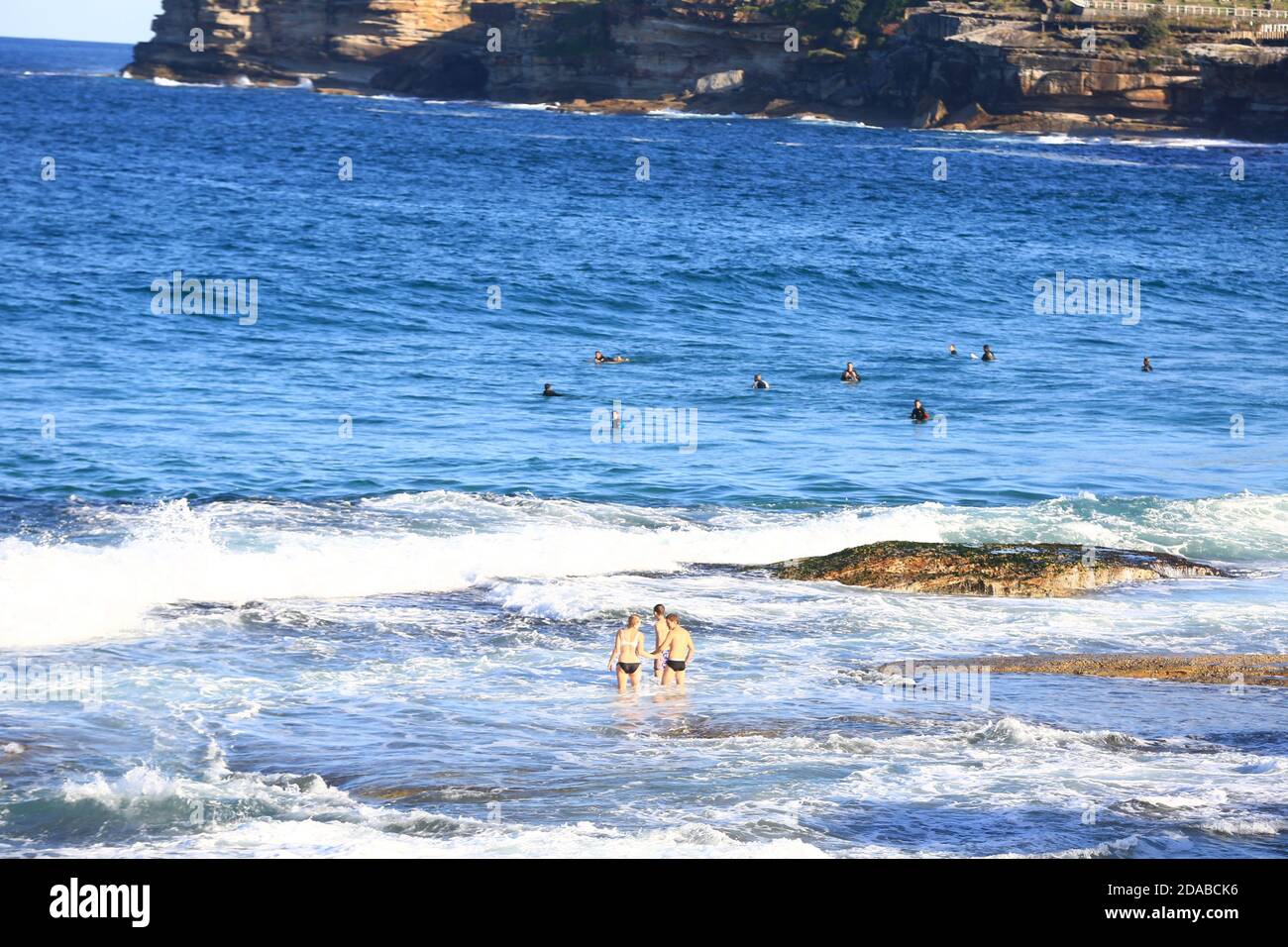 Bondi beach with wave and rocks Stock Photo - Alamy
