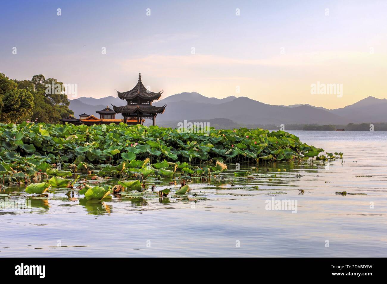 Evening scene on West Lake in Hangzhou, China with Jixian Pavillion and ...
