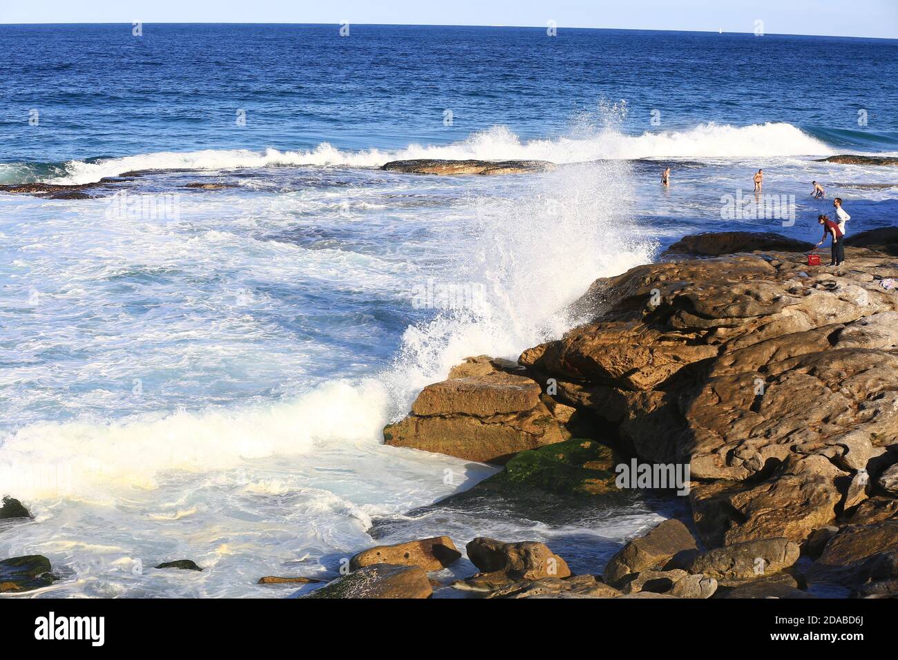 Bondi beach with wave and rocks Stock Photo - Alamy