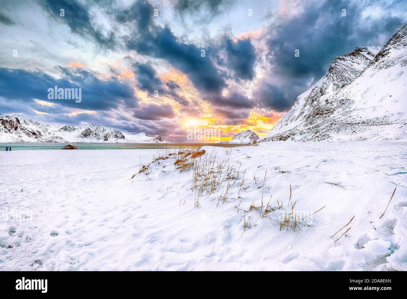 Fabulous winter scenery with Haukland beach during sunset and snowy ...