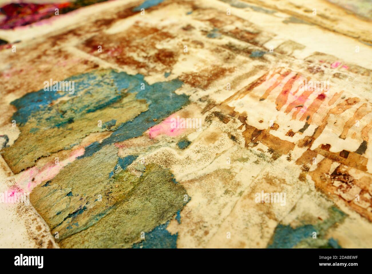 Sheet on paper damaged by chemical reaction. Corrosive acid-alkaline ...