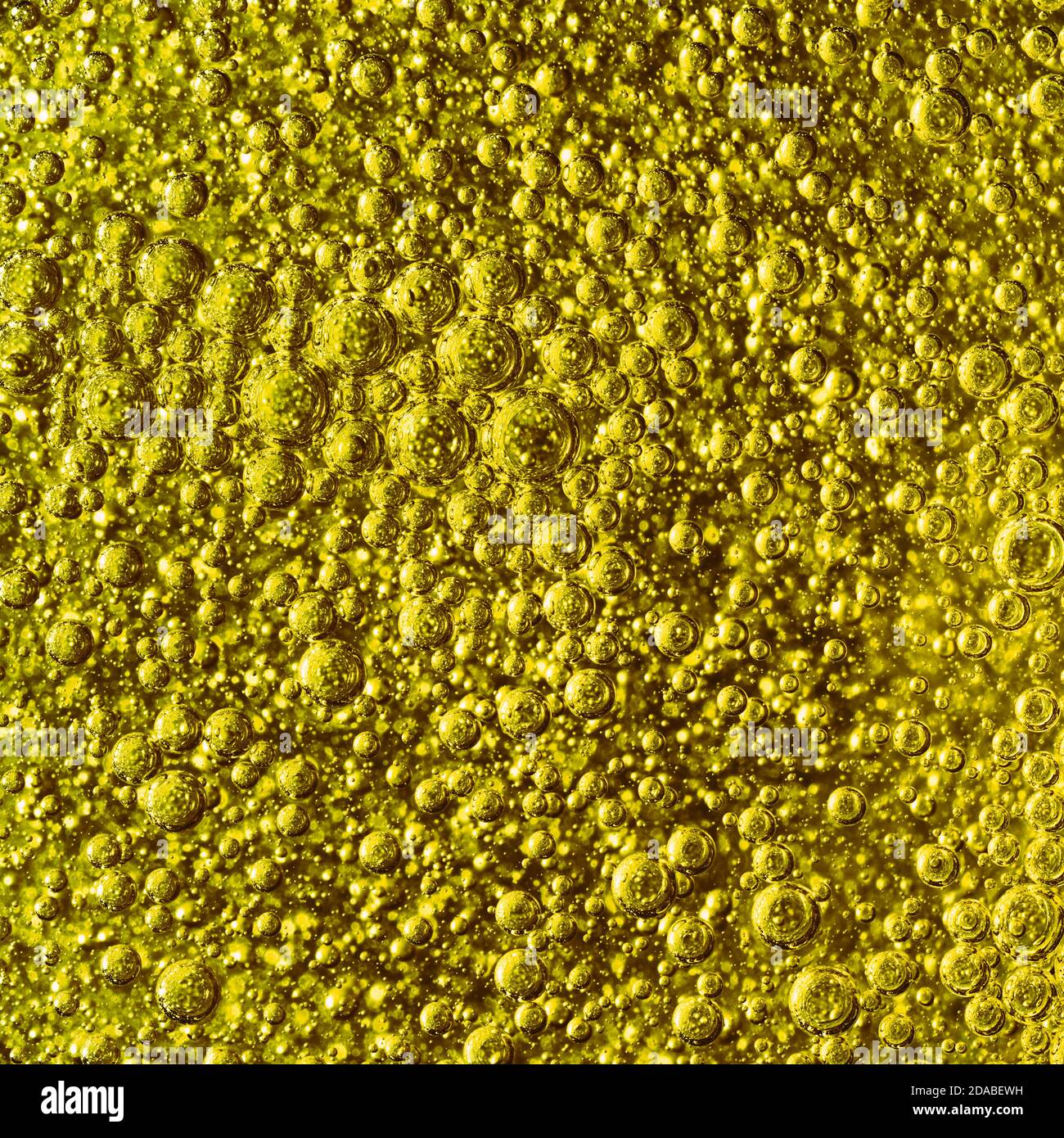Huge quantity of yellow air bubbles in liquid Stock Photo - Alamy