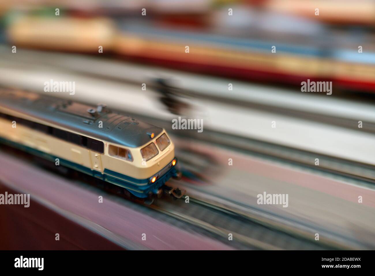 Model train locomotive moving on rails. Bird-eye view, motion blur ...