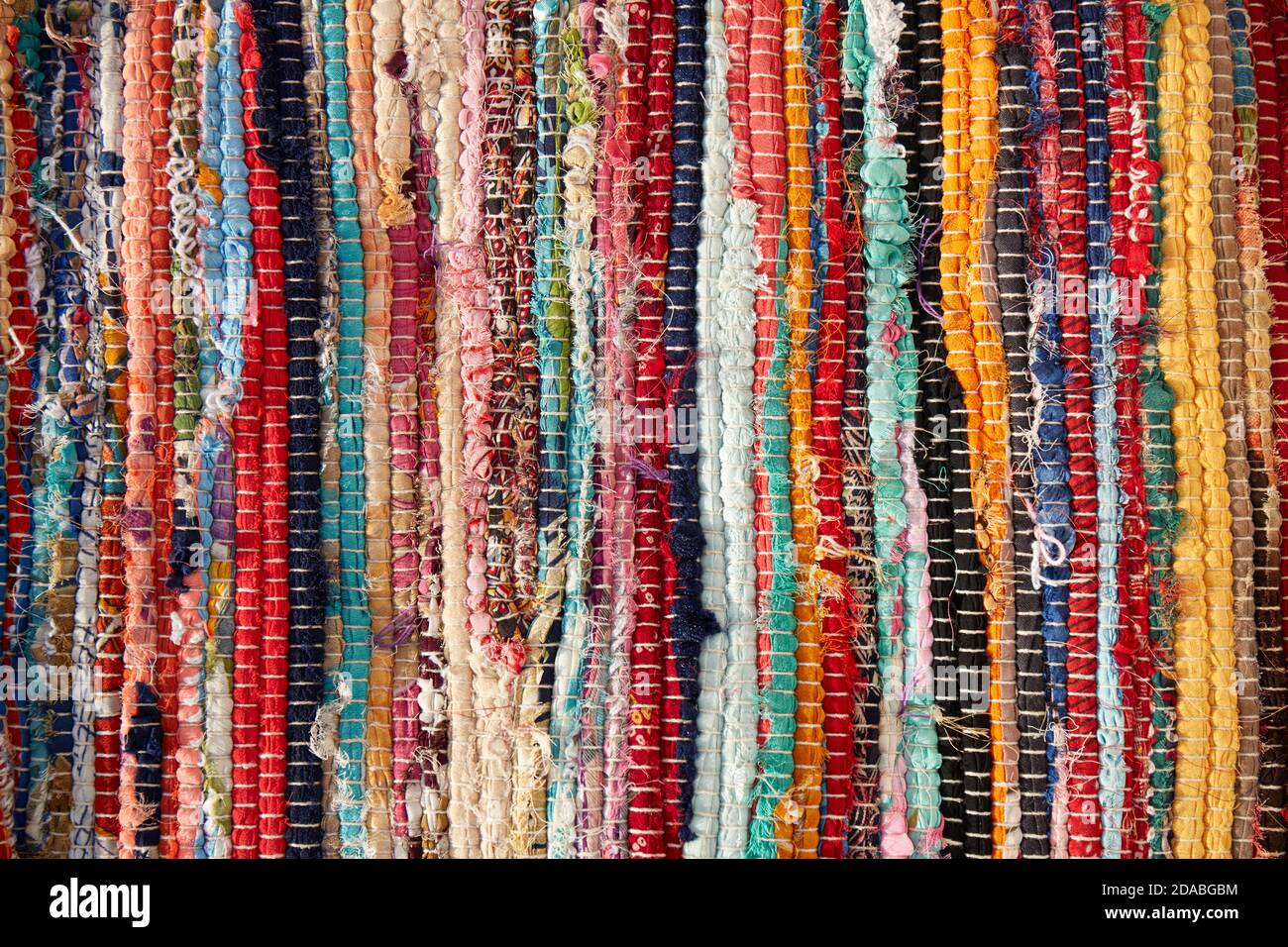 Colorful rough carpet woven with old fabrics Stock Photo - Alamy