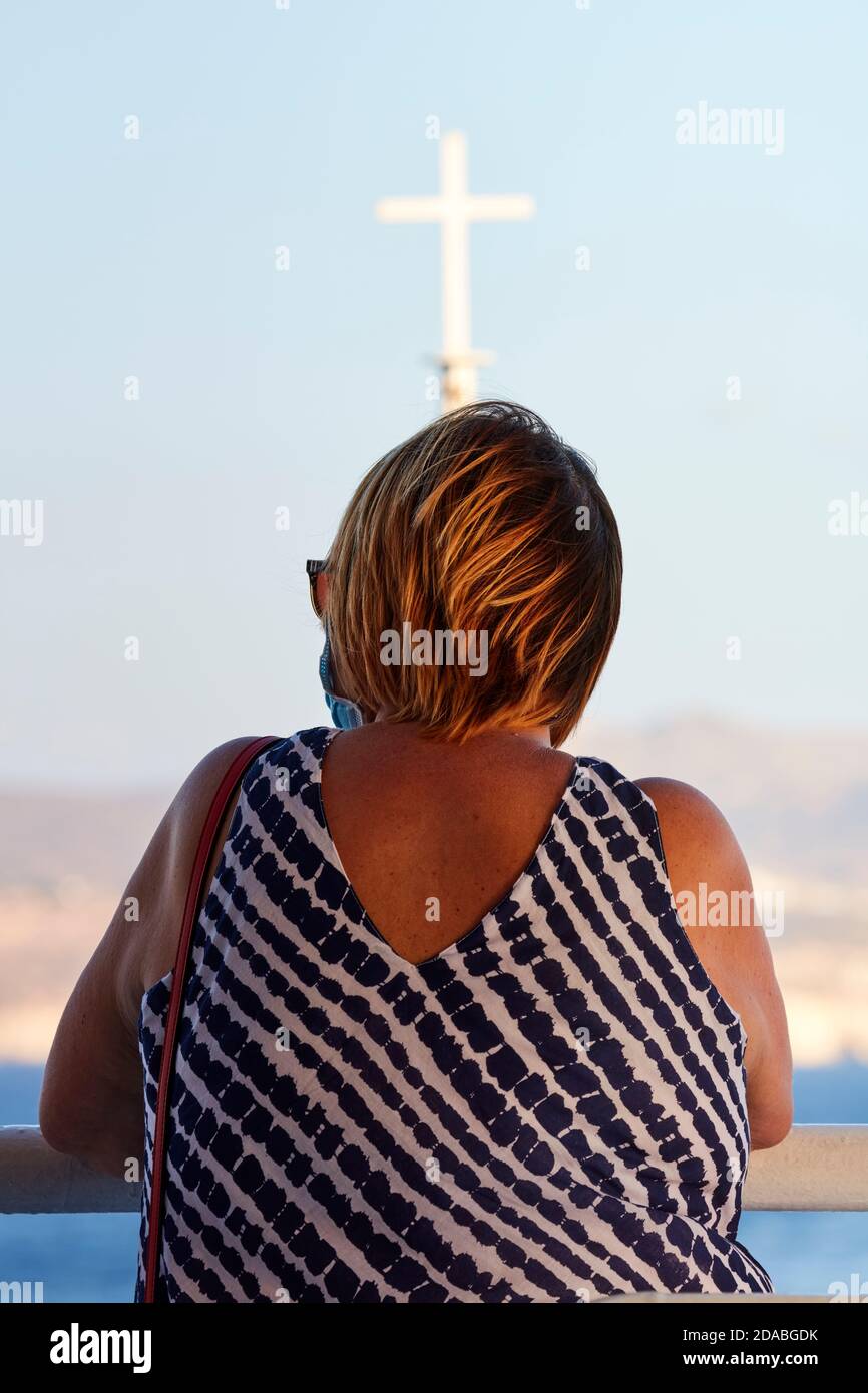 Woman and christian cross Stock Photo - Alamy