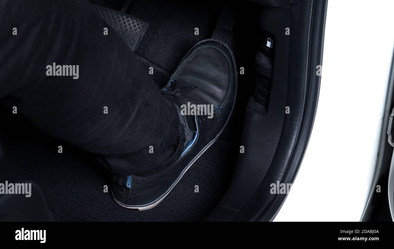 Close up images of man driving car by pushing accelerator and brake ...