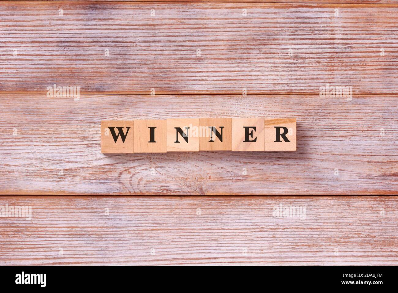 Word winner on cubes on white wooden background. Winner concept Stock ...