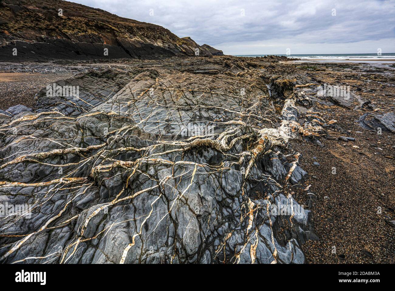 Alternating bands of sandstones and shales form the steep sides and ...