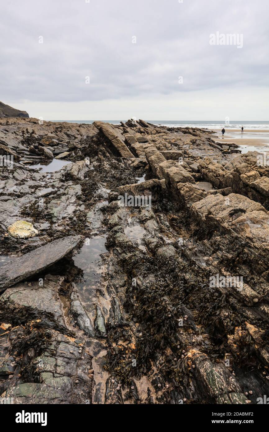 Alternating bands of sandstones and shales form the steep sides and ...