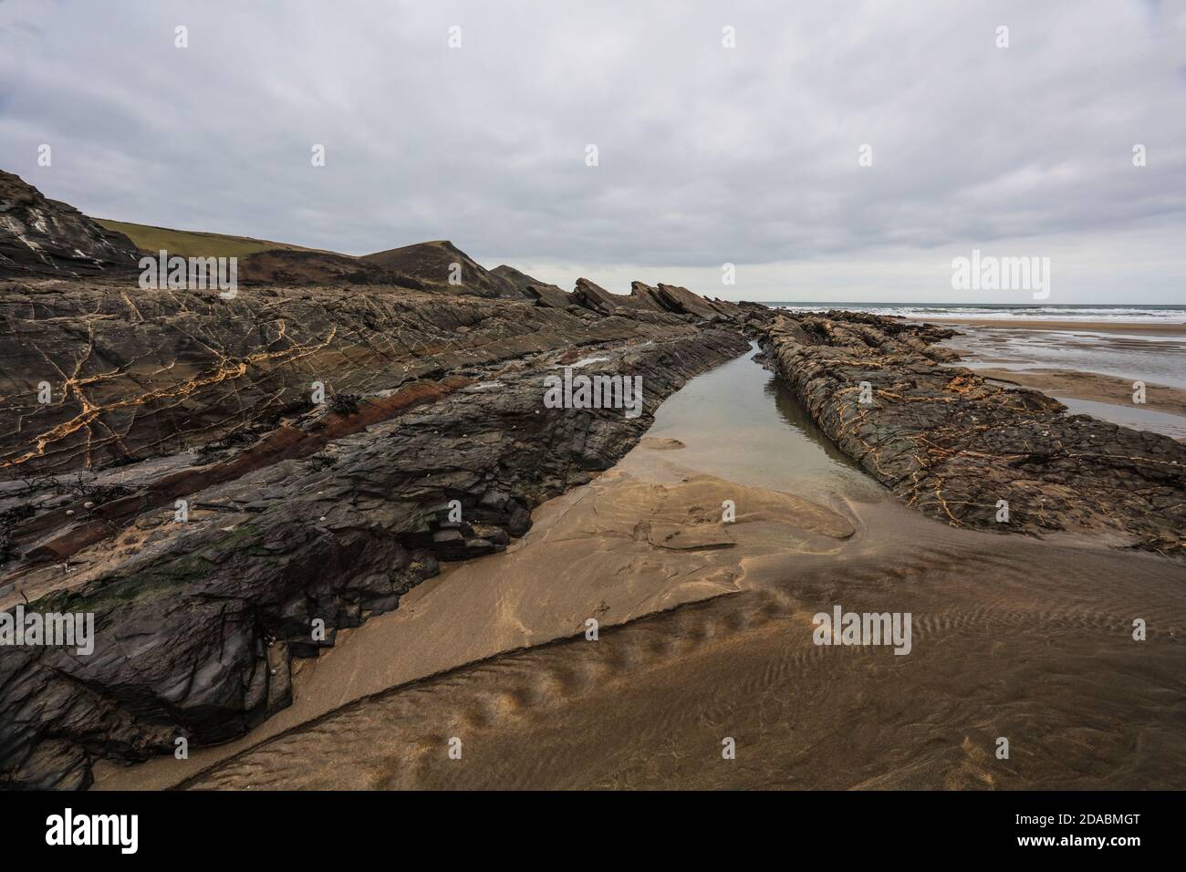 Alternating bands of sandstones and shales form the steep sides and ...