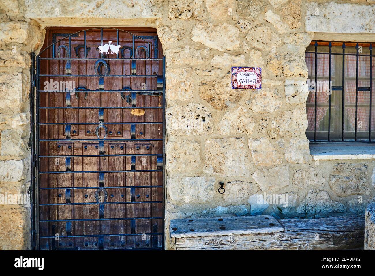 House with fence decorated with lucky horseshoe motifs. Traditional ...
