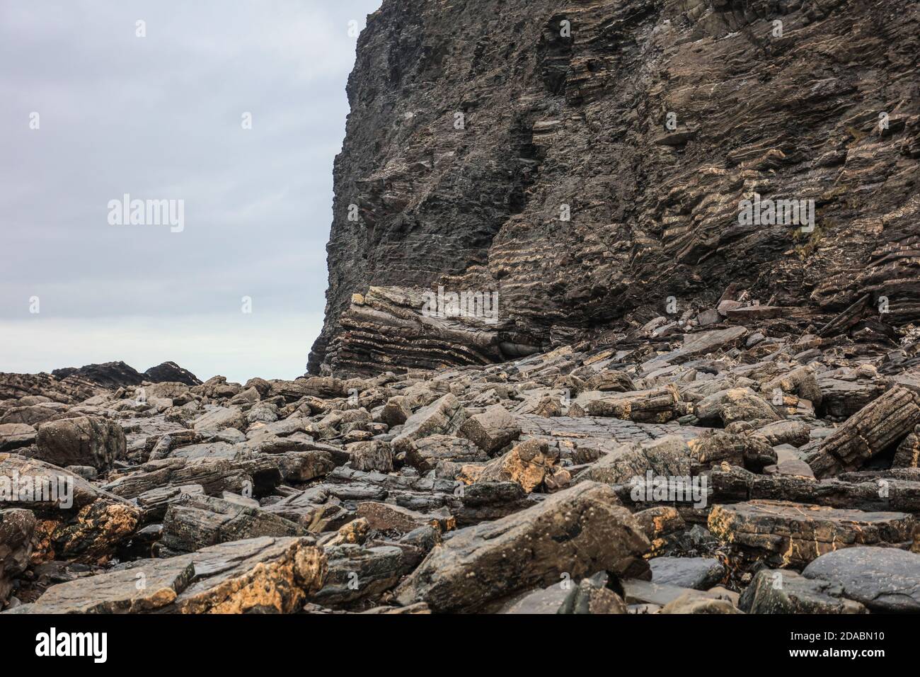 Alternating bands of sandstones and shales form the steep sides and ...