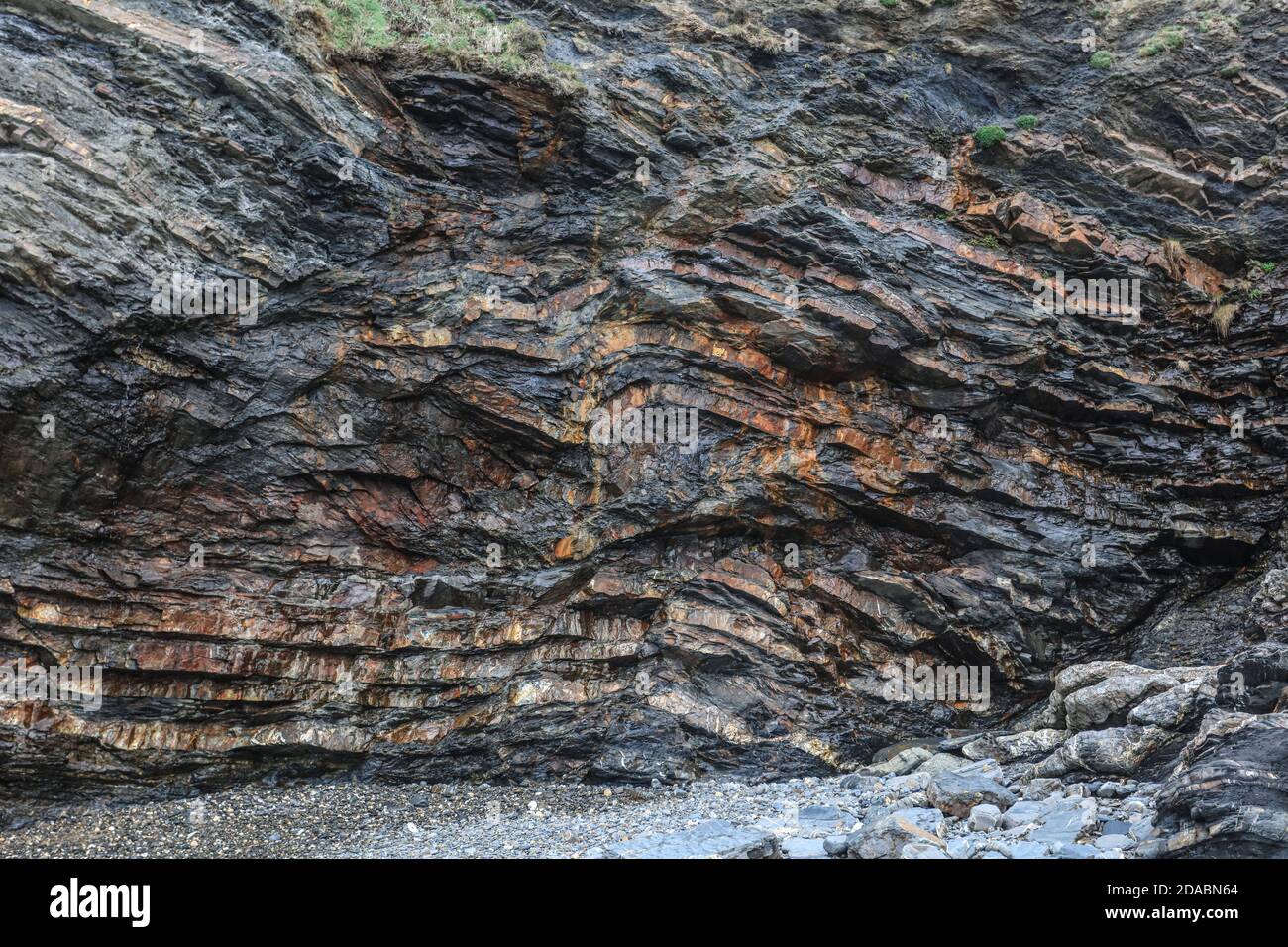 Alternating bands of sandstones and shales form the steep sides and ...