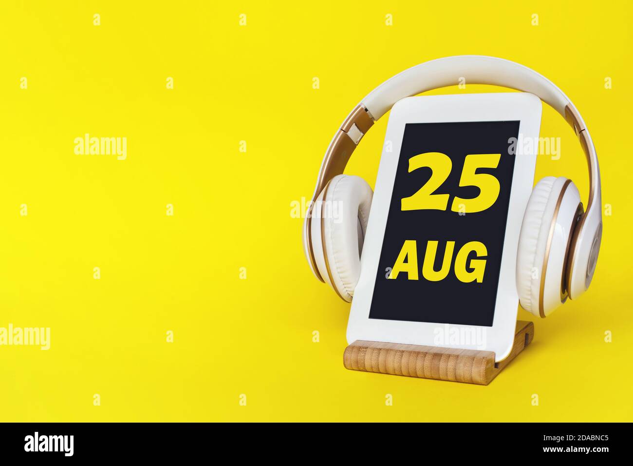 August 25th. Day 25 of month, Calendar date. Stylish headphones and ...