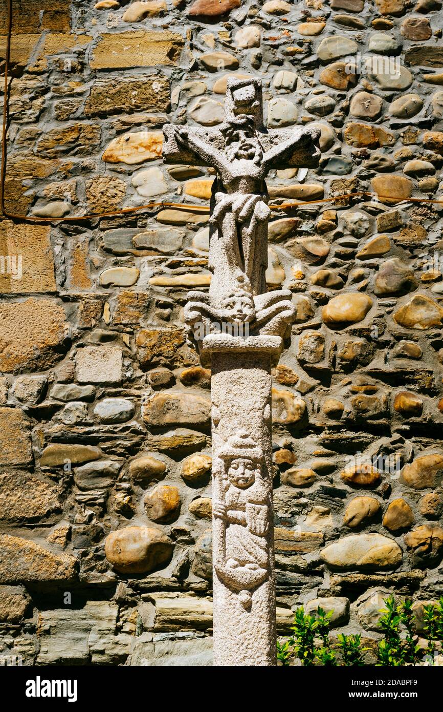 Carved stone cross, with crucified Christ and pilgrim motives. French ...