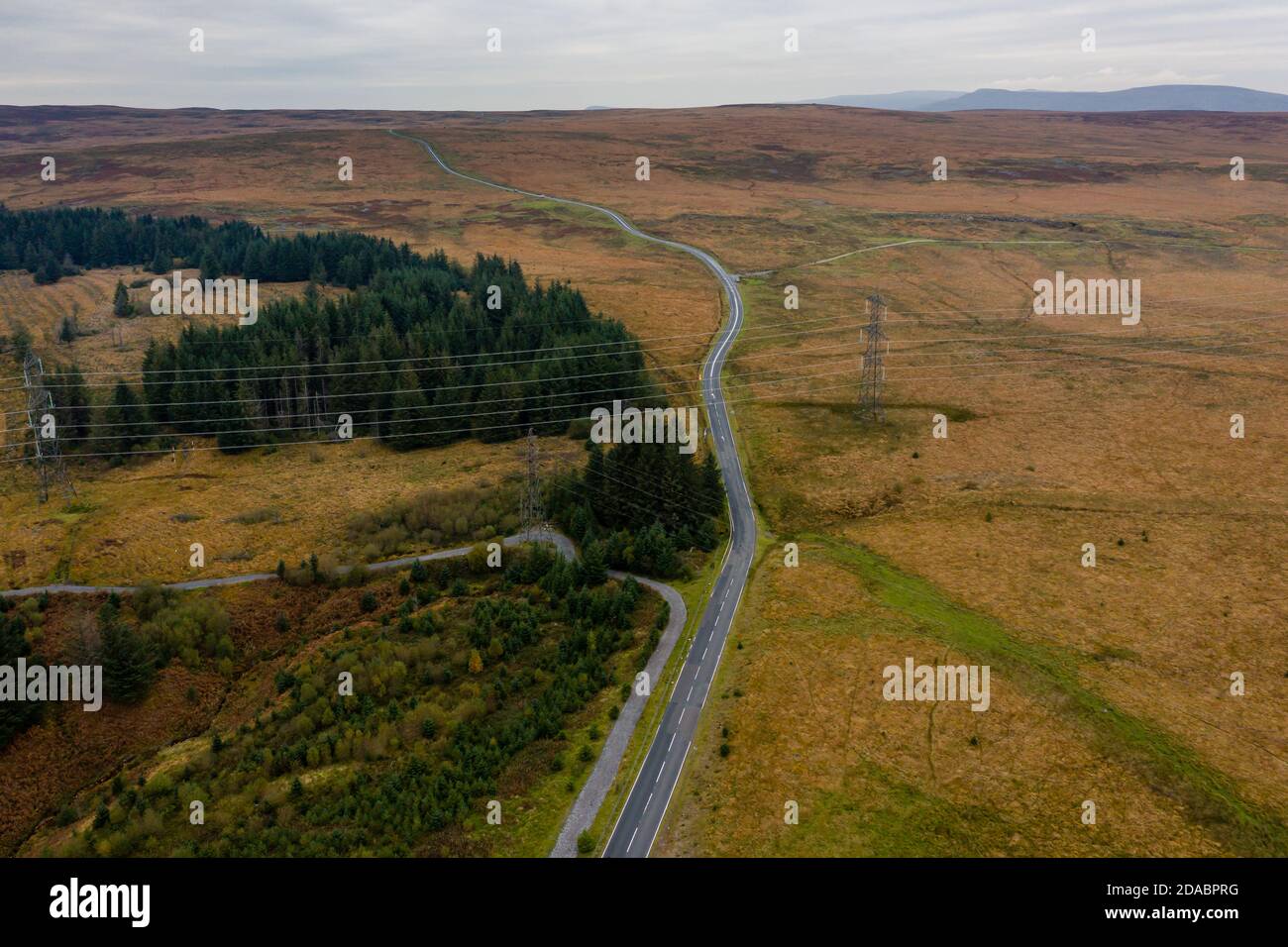 Aerial view of a narrow, winding road across rural moorland in South ...