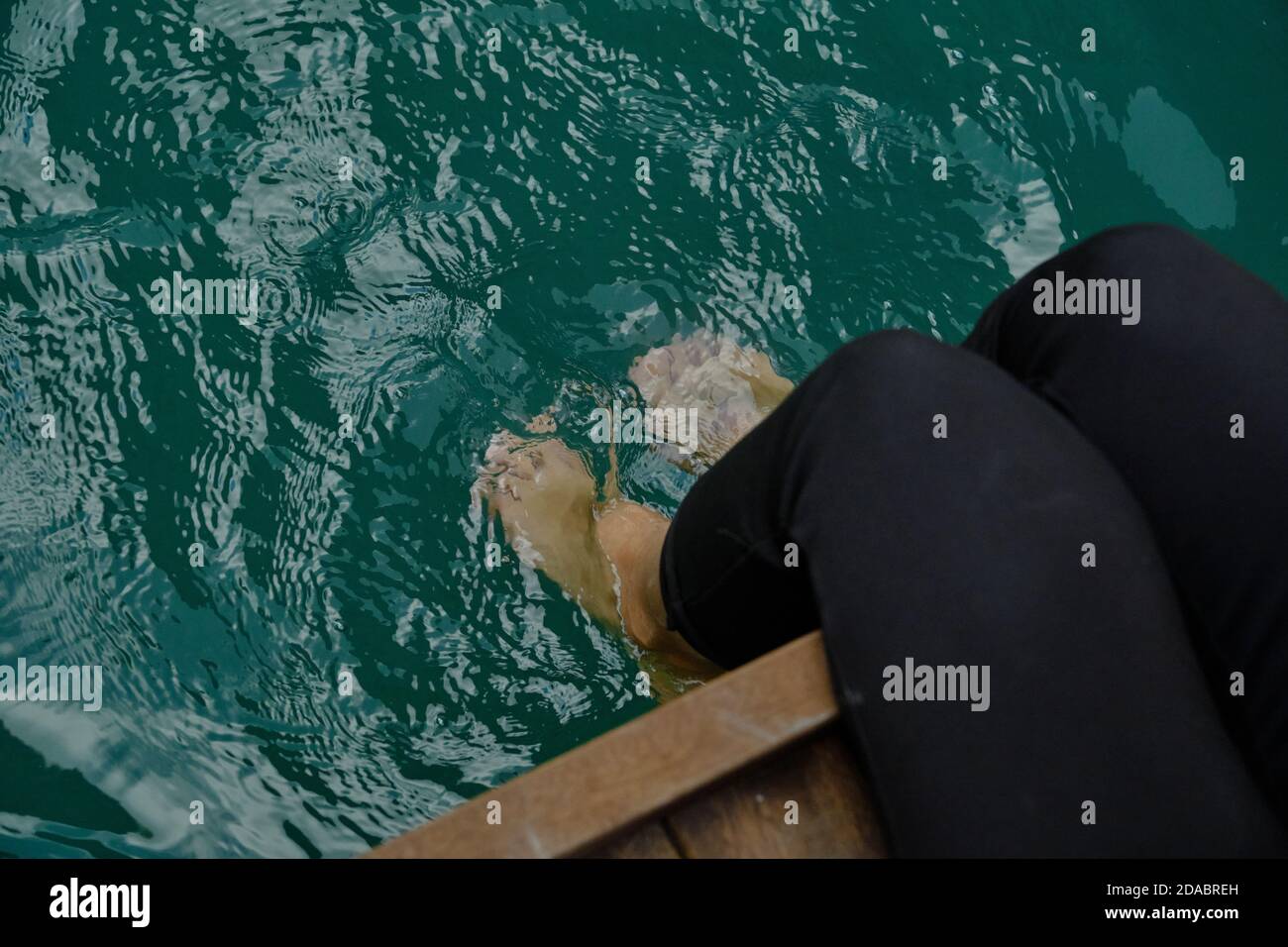 girl at the pond feet in the water Stock Photo - Alamy