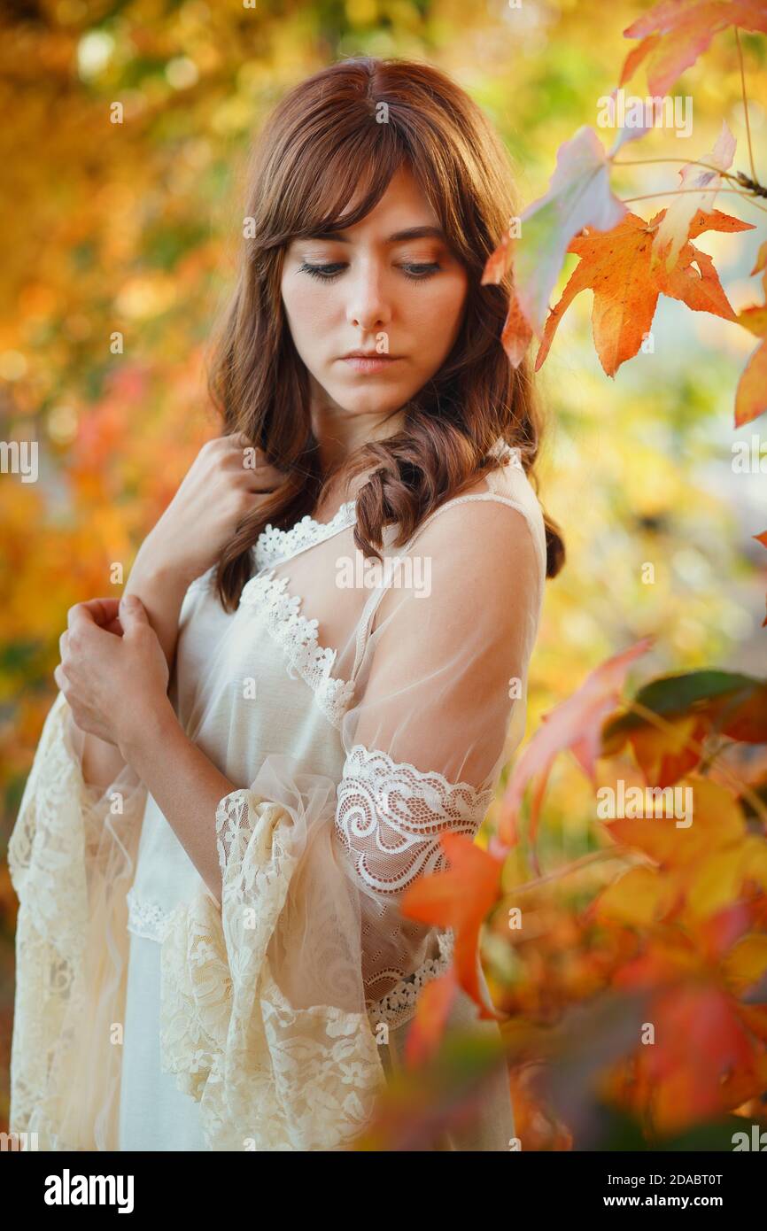 Autumn portrait of red haired woman. Colorful leaves Stock Photo - Alamy