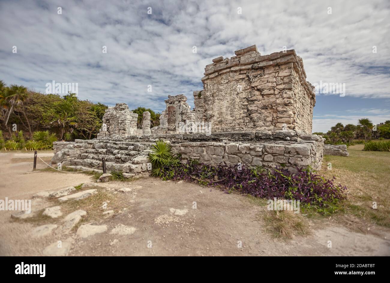 Side view of the remains of a small Mayan temple in the Tulum complex ...