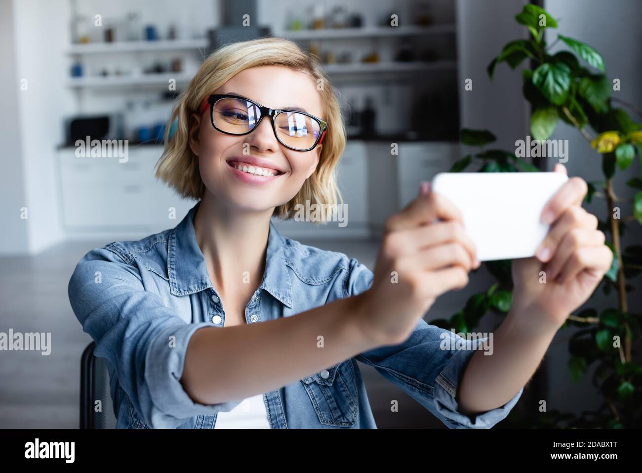 Beautiful blonde woman taking selfie hi-res stock photography and ...