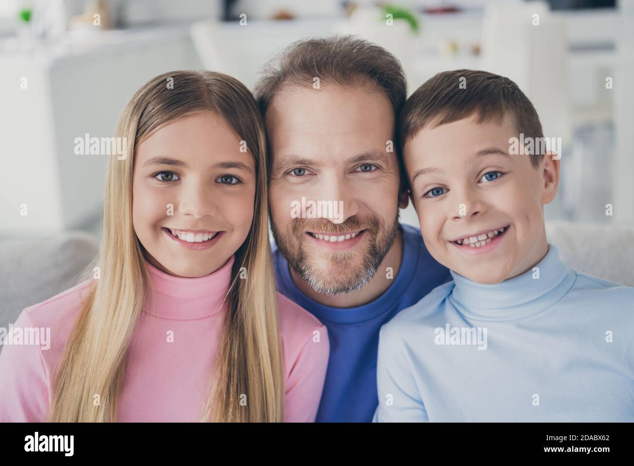 Idyllic family portrait of father with two kids boy girl toothy smile ...