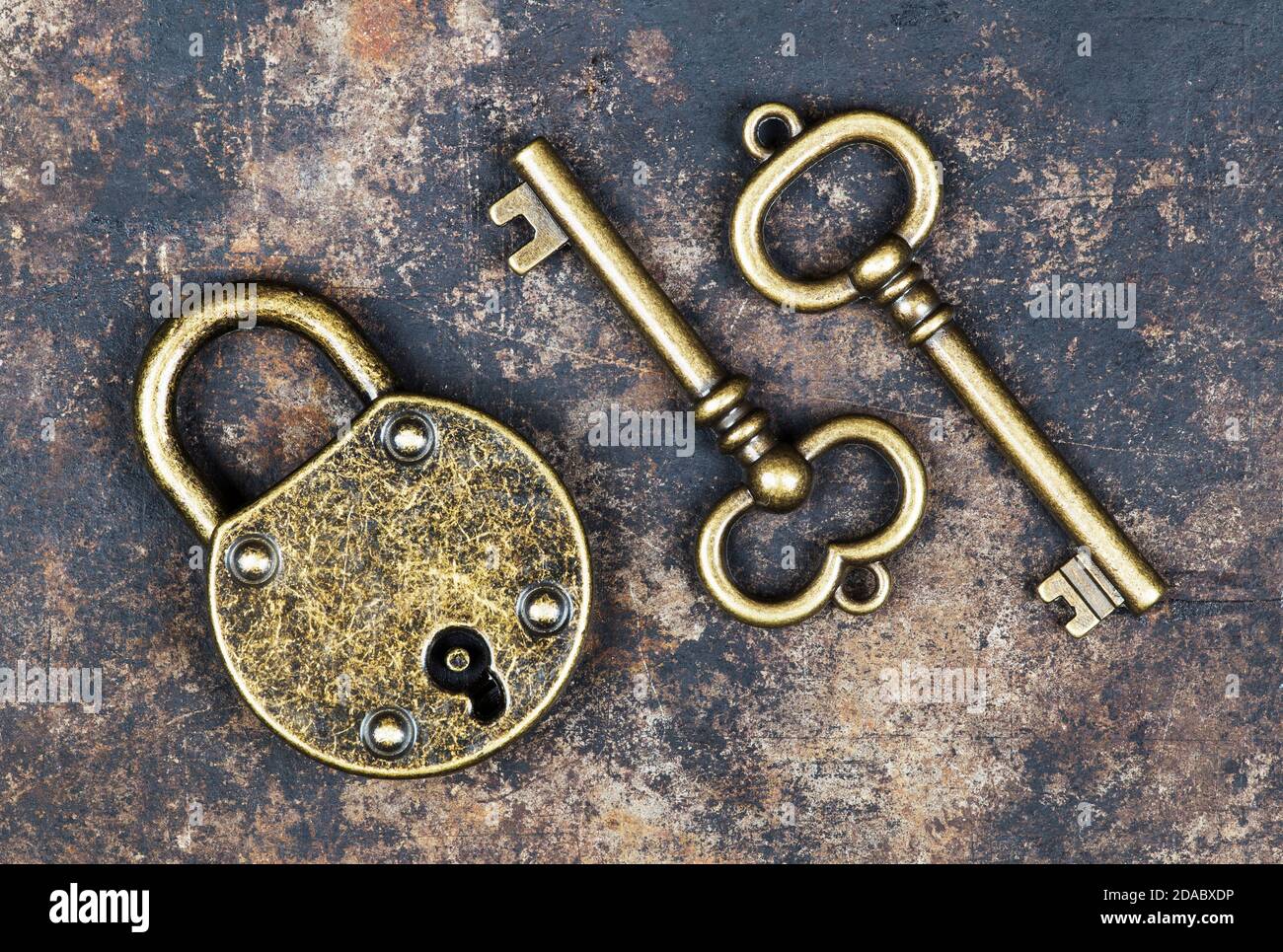 Escape room game concept, old vintage keys and a padlock on rusty ...