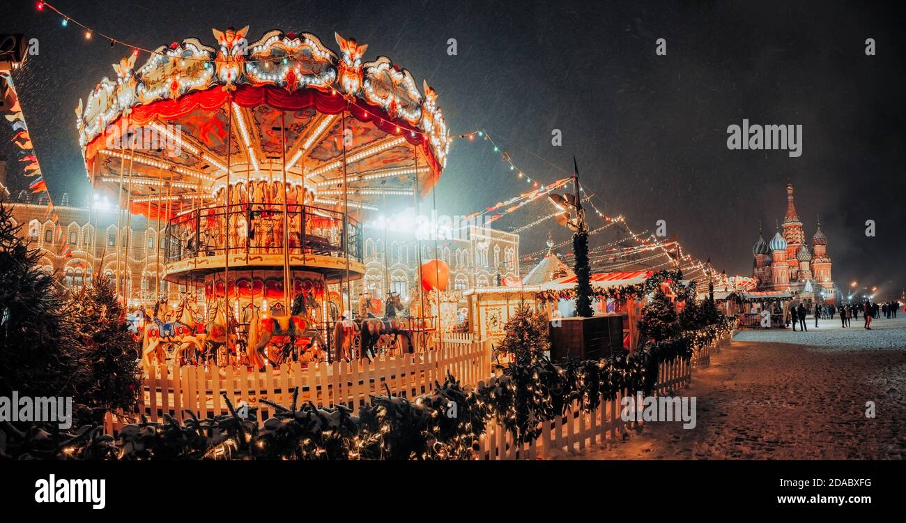 Beautiful brightly glowing carousel on the Red Square decorated and ...