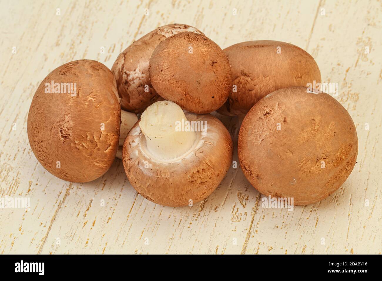 Tasty Raw Brown Champignons over background Stock Photo - Alamy