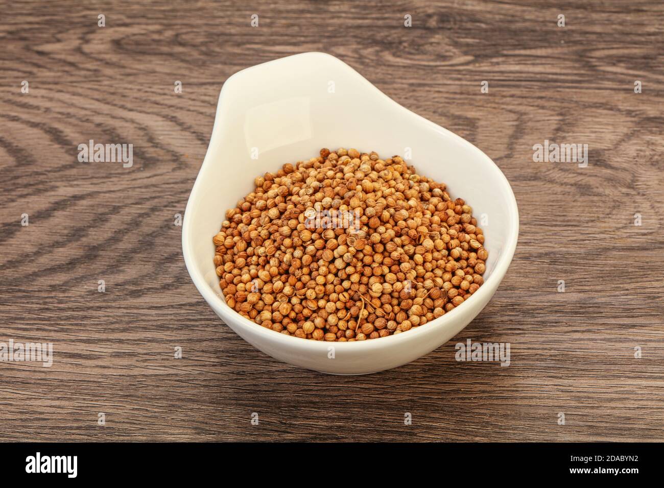 Dry Coriander seeds in the bowl Stock Photo - Alamy