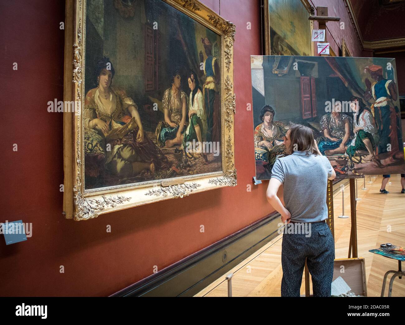 Artist copying a painting at the Louvre museum in Paris Stock Photo - Alamy