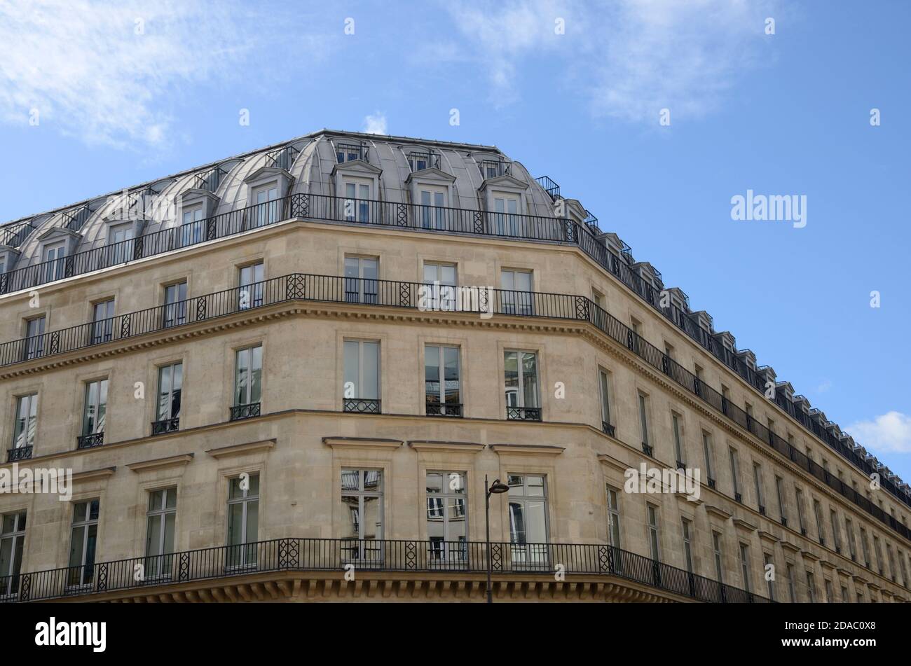Large windows and cozy balconies on traditional Parisian architecture ...