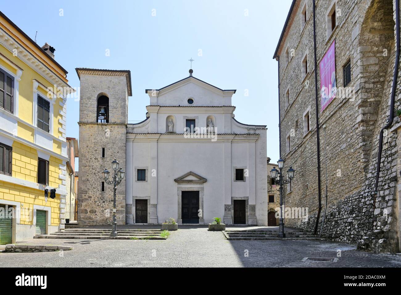 A narrow street among the old houses of Amaseno, a medieval village in ...