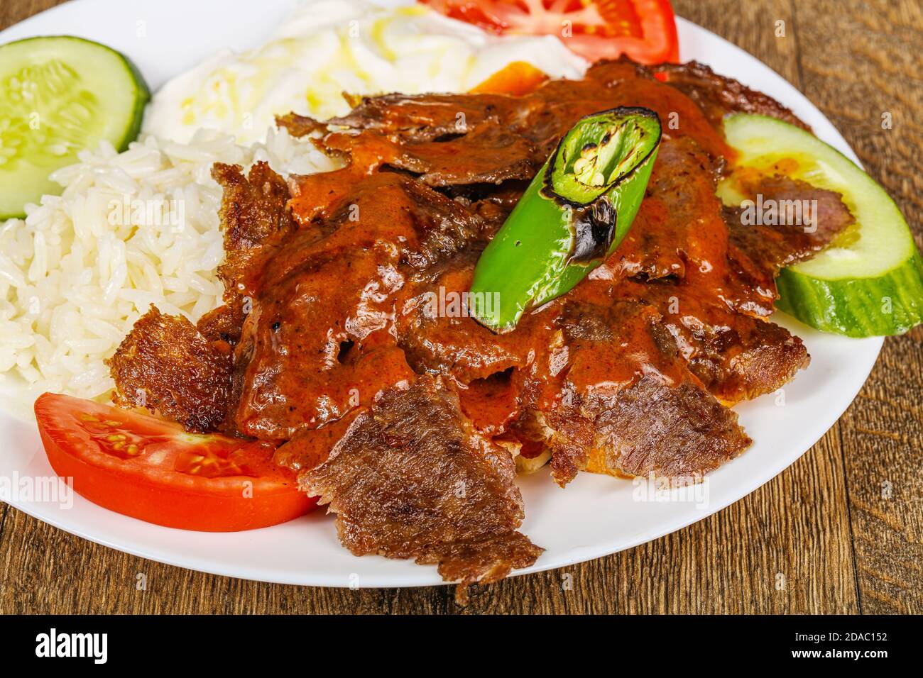 Turkish cuisine - Iskander kebab grilled meat with sauce Stock Photo ...
