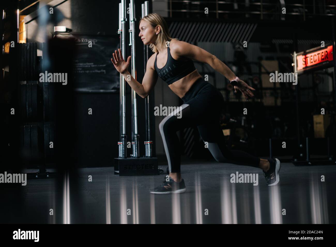 Portrait of sportive young woman runner with perfect athletic body ...