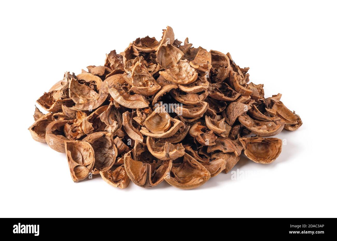 Pile of empty broken walnut shells isolated on white background ...