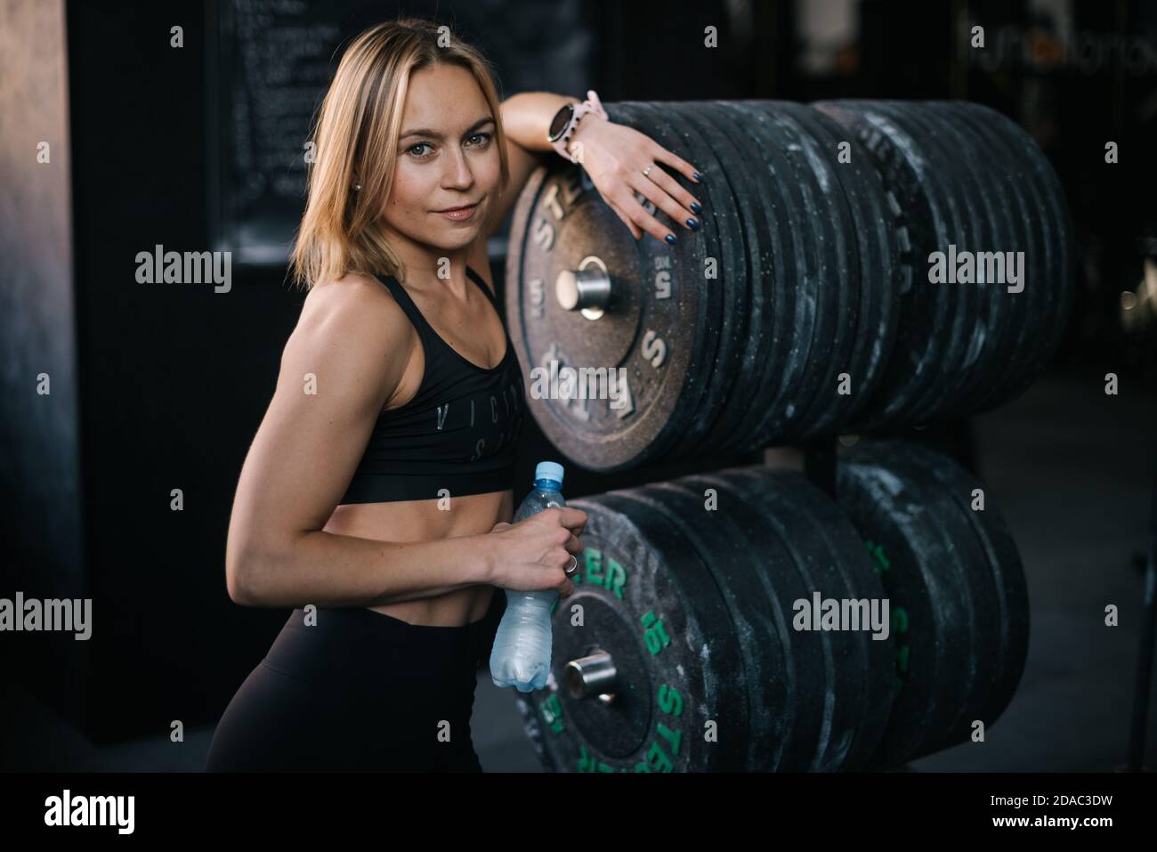 Portrait of Muscular woman with perfect athletic body posing while ...